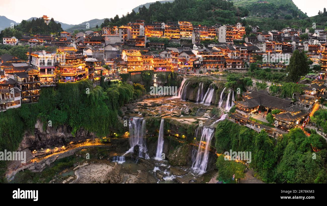 Beautiful ancient town in China with waterfall and traditional houses ...