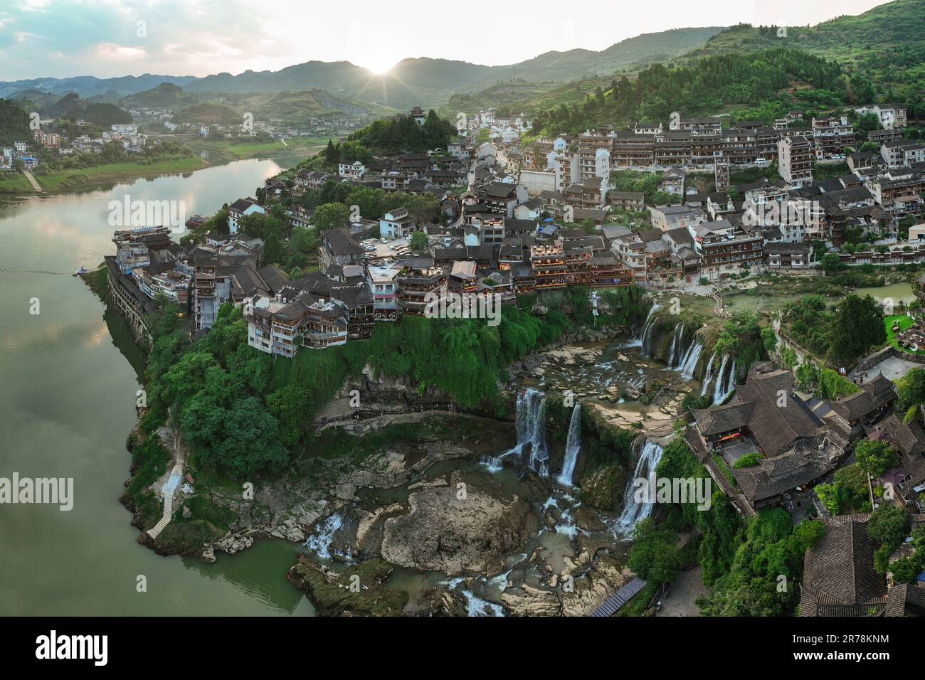 Beautiful ancient town in China with waterfall and traditional houses ...