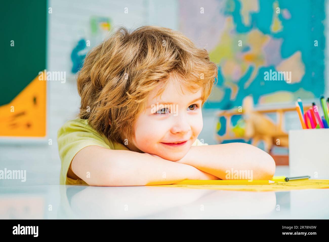 Happy school kids at lesson. Kid gets ready for school. Cute pupil with ...