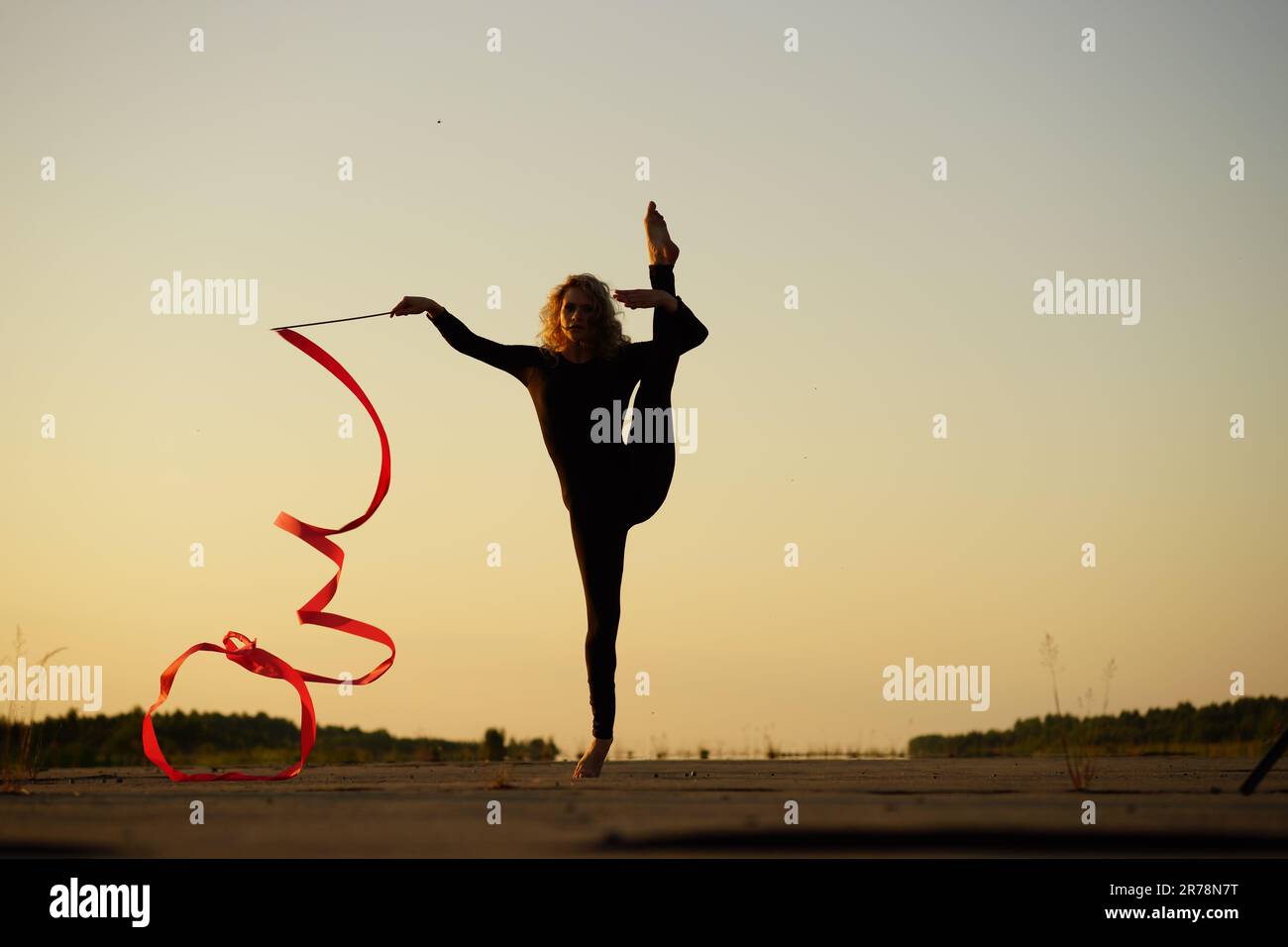 Professional gymnast woman dancer with ribbon Stock Photo - Alamy