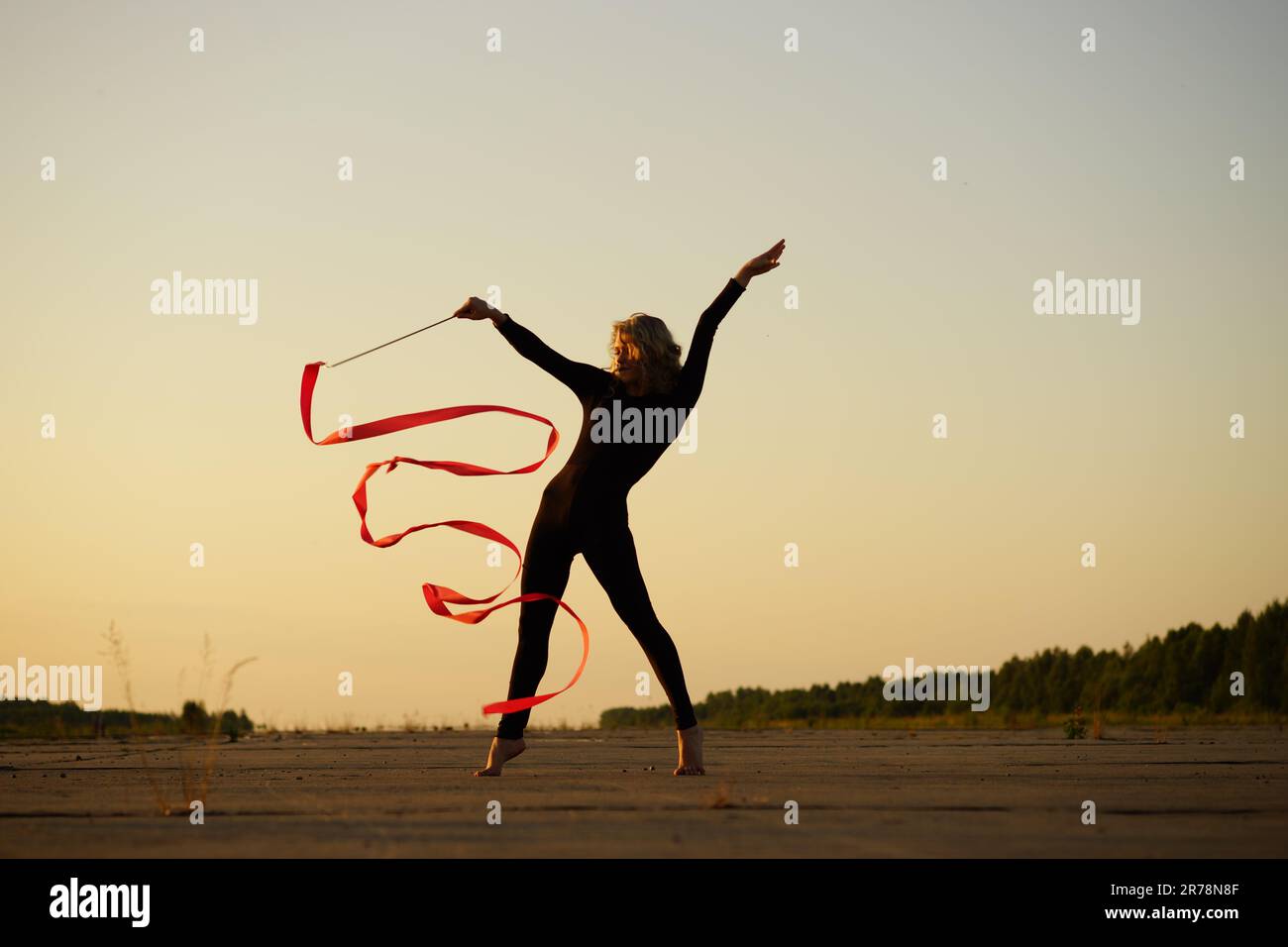 Professional gymnast woman dancer with ribbon Stock Photo - Alamy