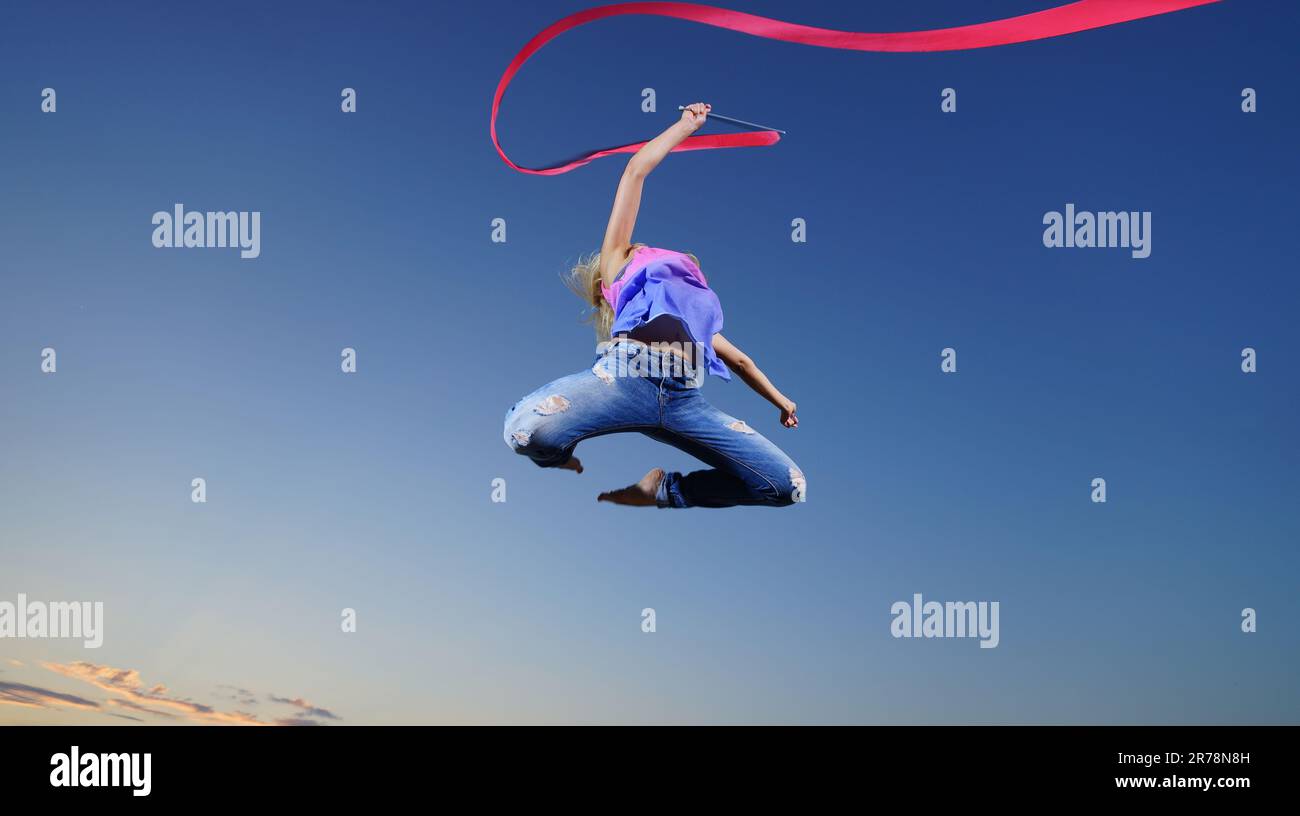 Professional gymnast woman dancer jumping with ribbon Stock Photo - Alamy
