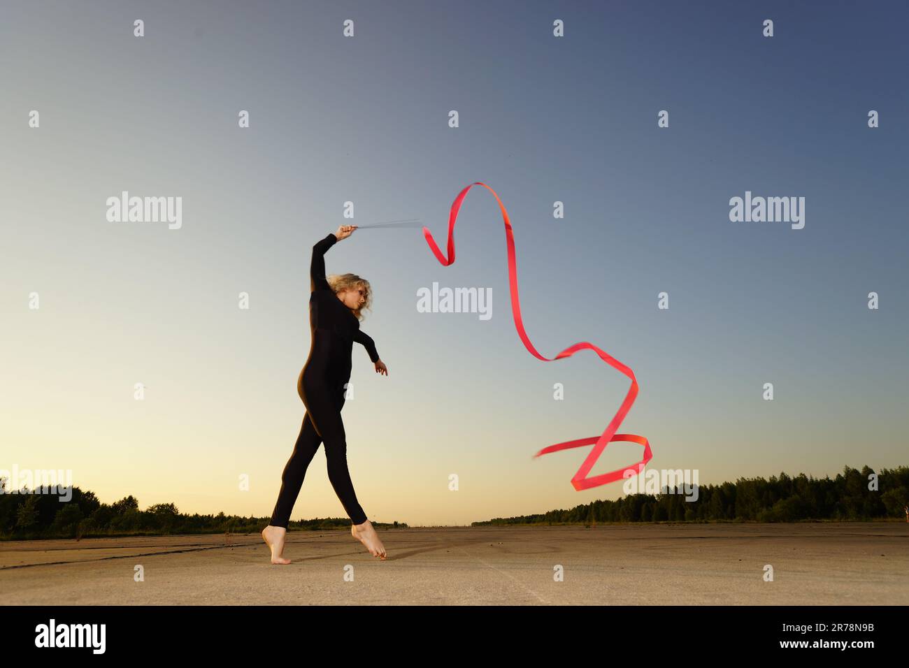 Professional gymnast woman dancer with ribbon Stock Photo - Alamy