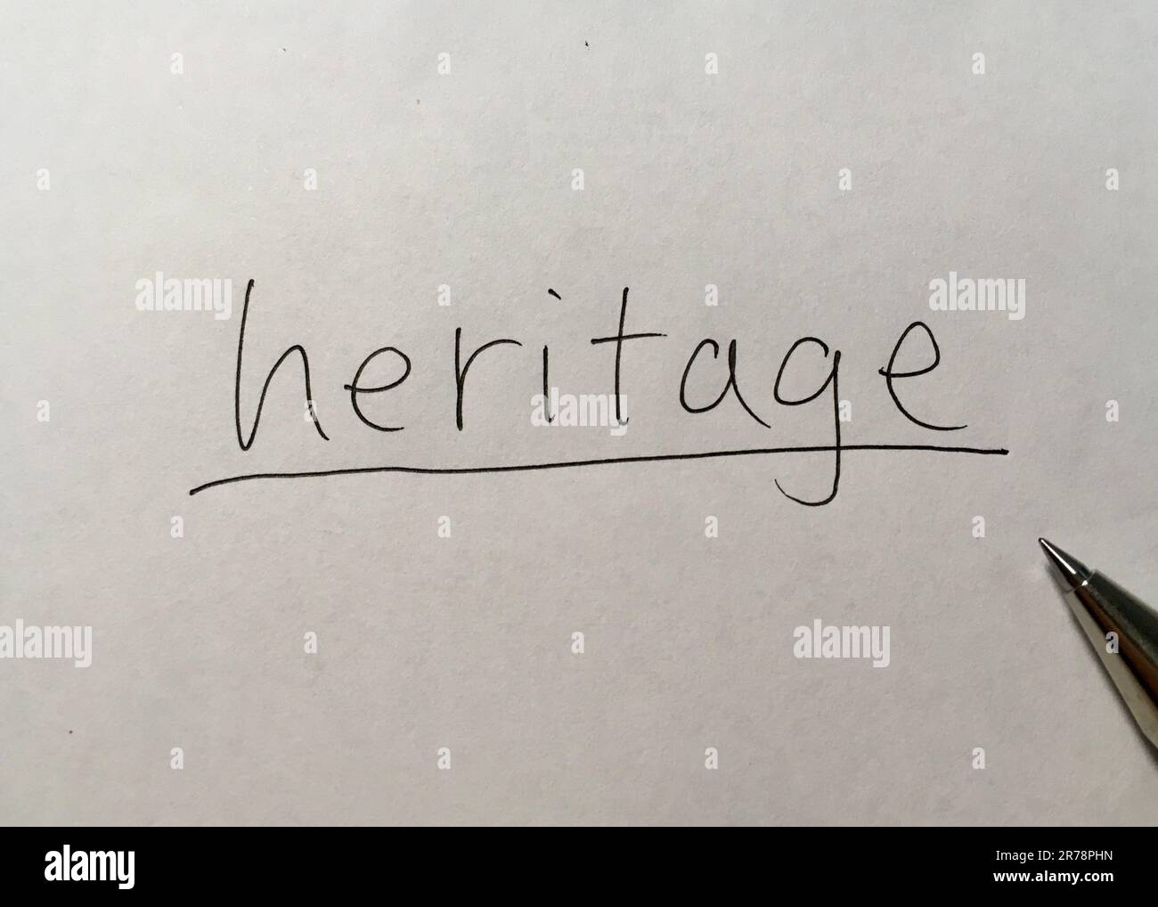 Heritage concept word on paper background Stock Photo - Alamy