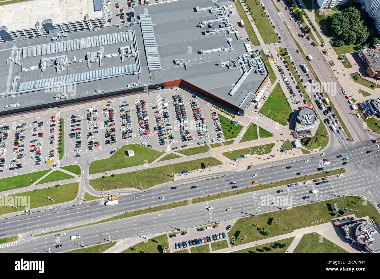 shopping mall with parking lot. road junction in urban residential area ...