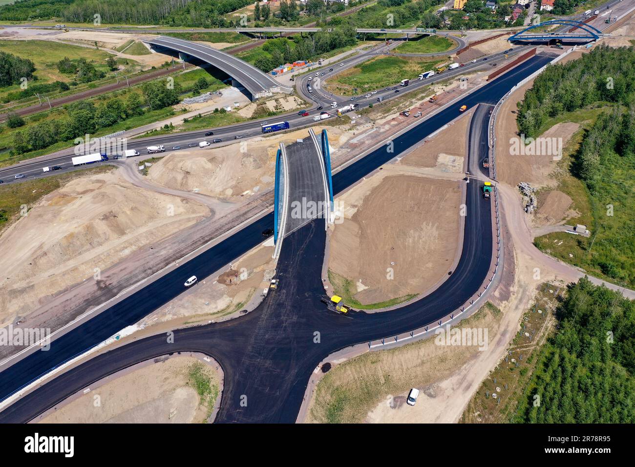 12 June 2023, Saxony, Böhlen: The first asphalt layer has already been ...
