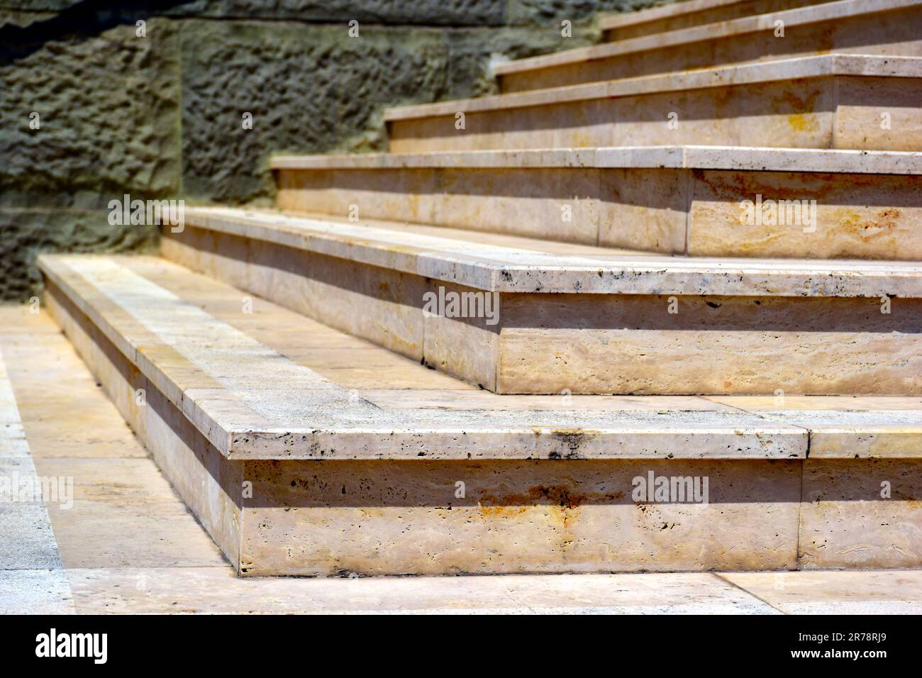 beige color exterior soft stone stairs. abstract closeup view of corner ...
