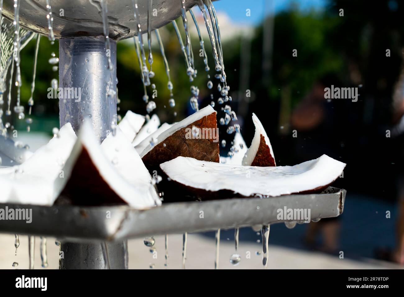A fountain with crystal clear water droplets cascading over pieces of ...