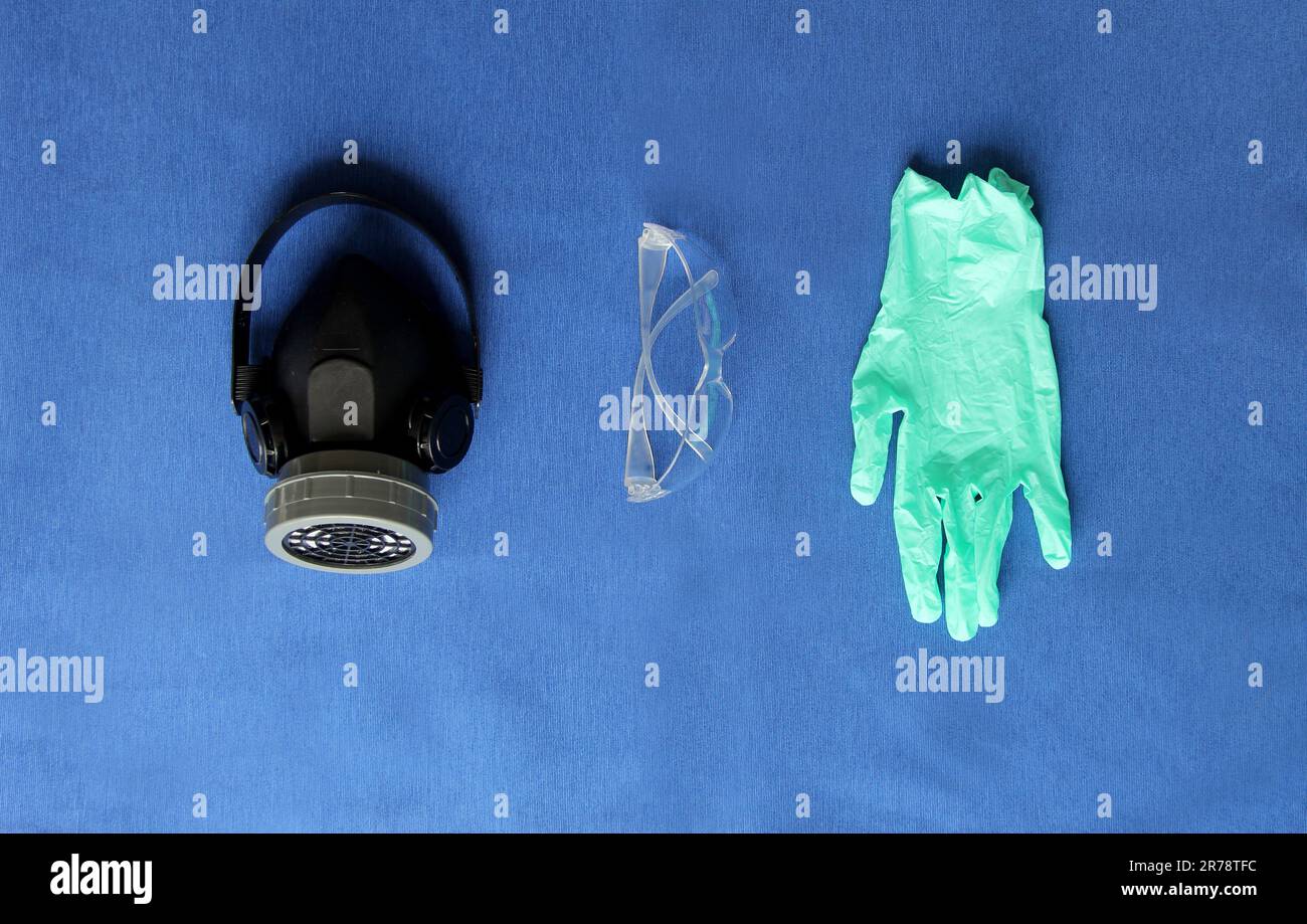 Latex Gloves Glasses Mouthguards And Antibacterial Gel On A Blue