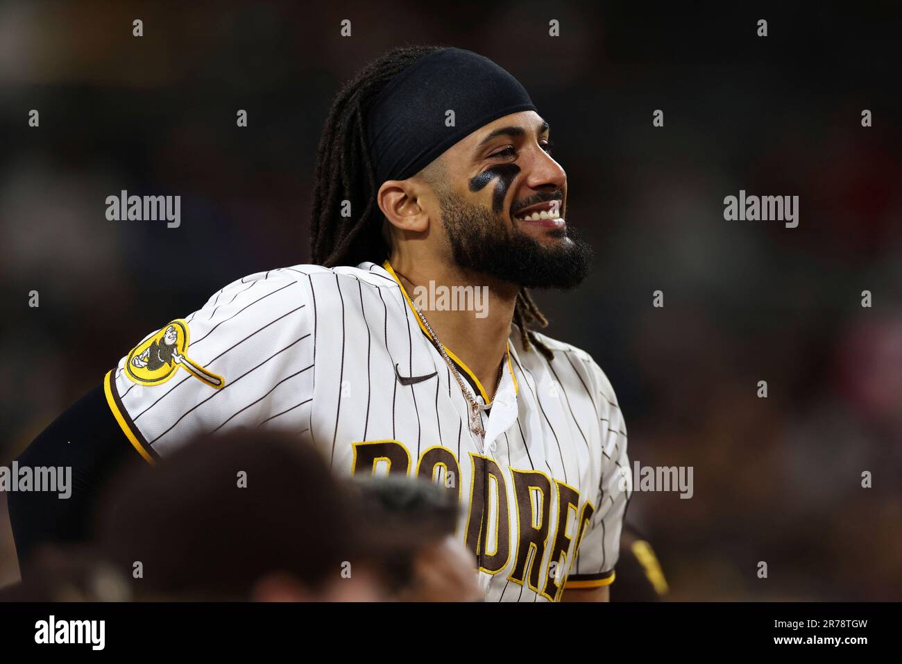 San Diego Padres' Fernando Tatis Jr. smiles while looking out from the ...