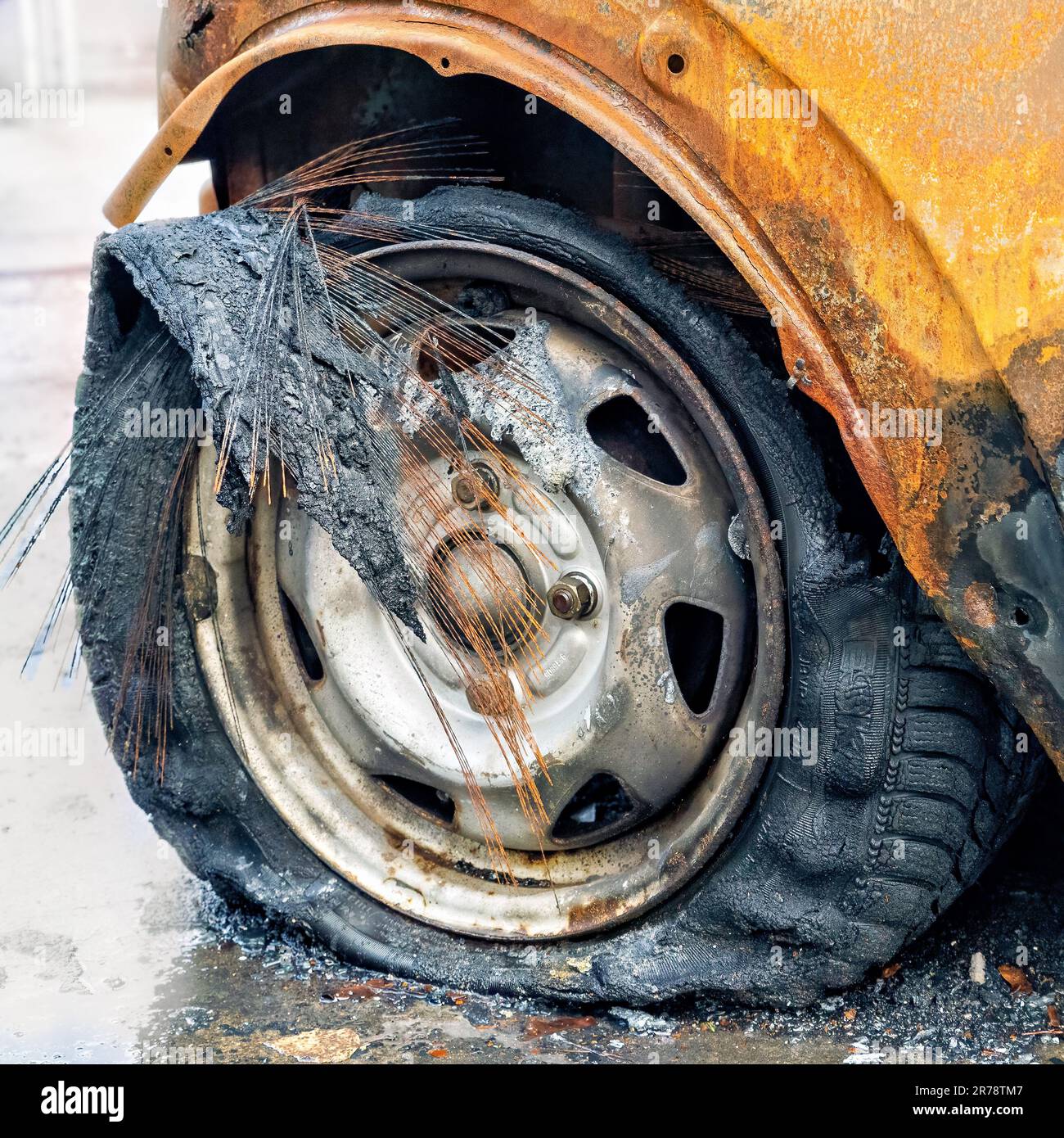 A close-up of an old, rusty wheel of a burnt yellow car Stock Photo - Alamy