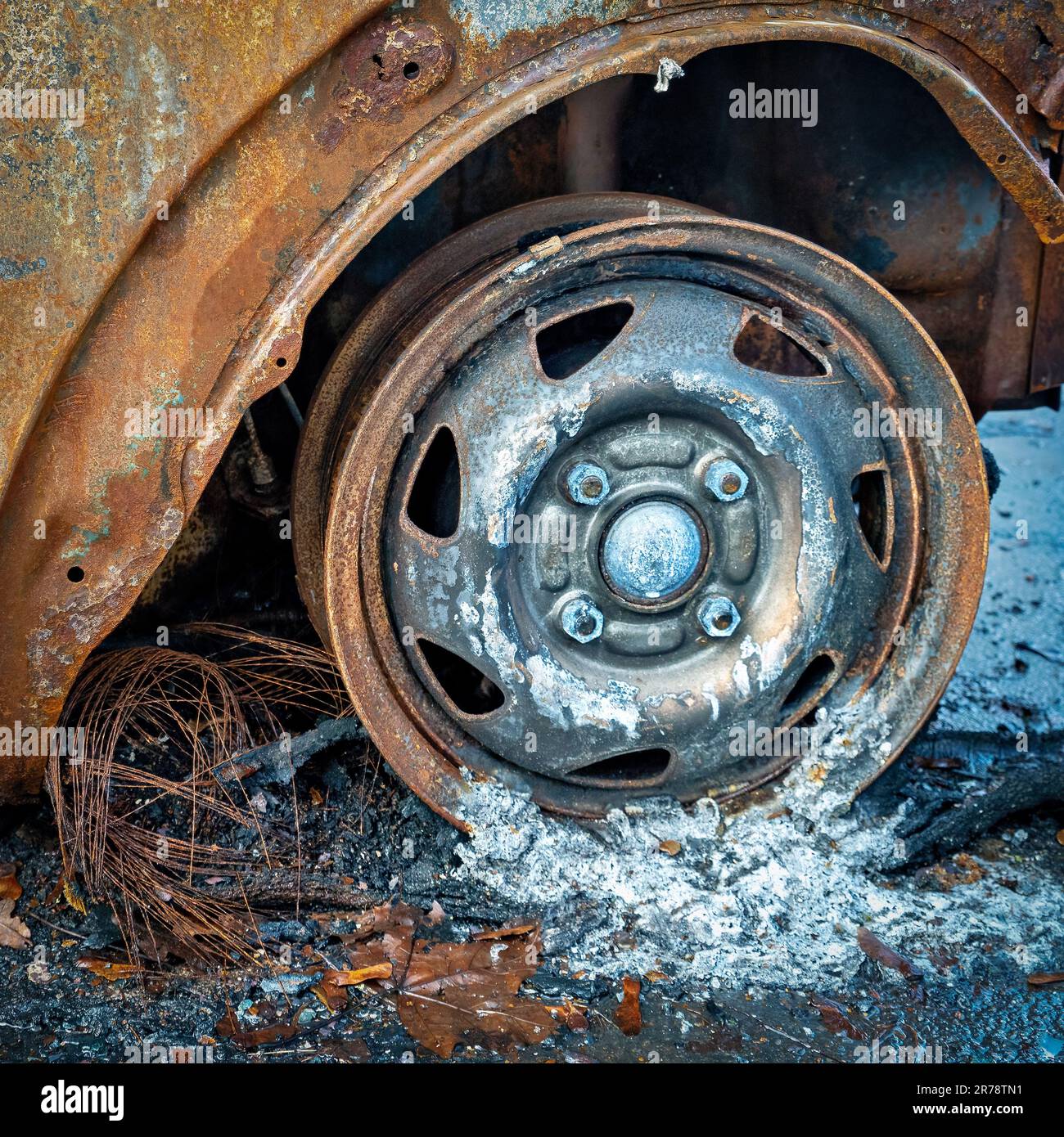 A close-up of an old, rusty wheel of a burnt yellow car Stock Photo - Alamy