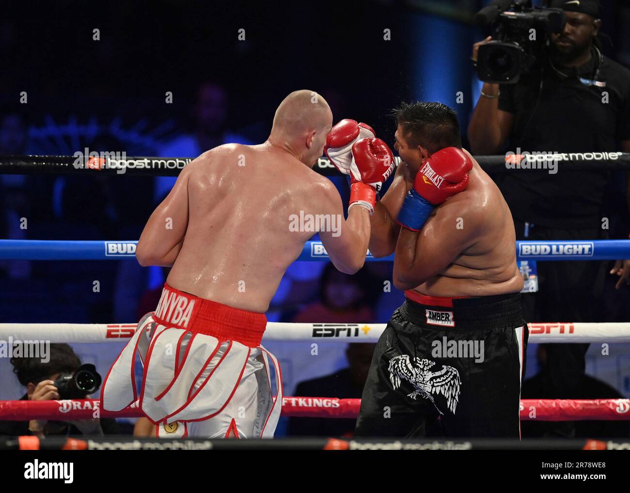 NEW YORK, NY - JUNE 10: Damian Knyba (red tape) takes on Helaman Olguin ...