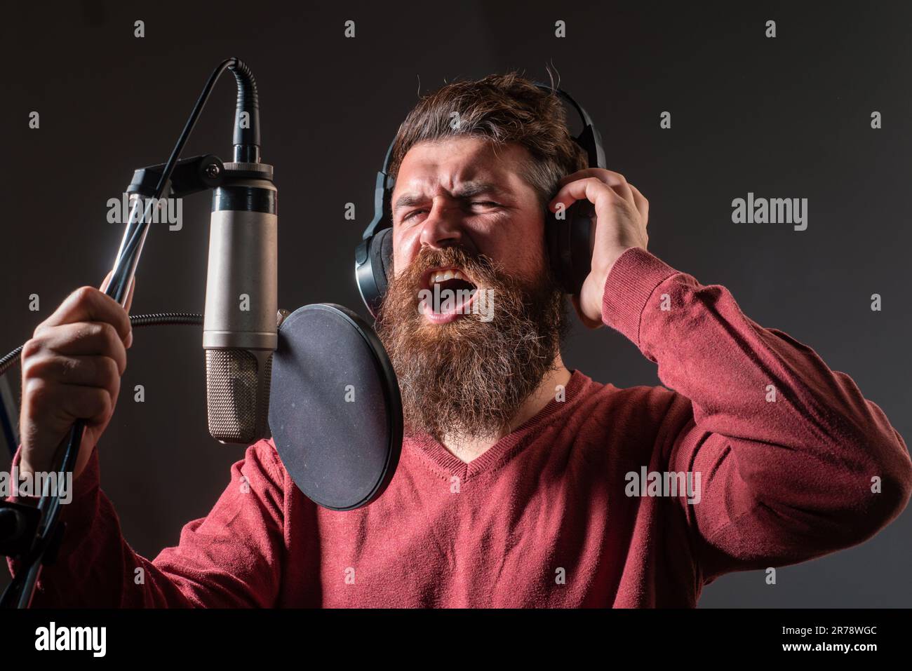 Sound producer. Handsome man in recording studio. Music performance ...