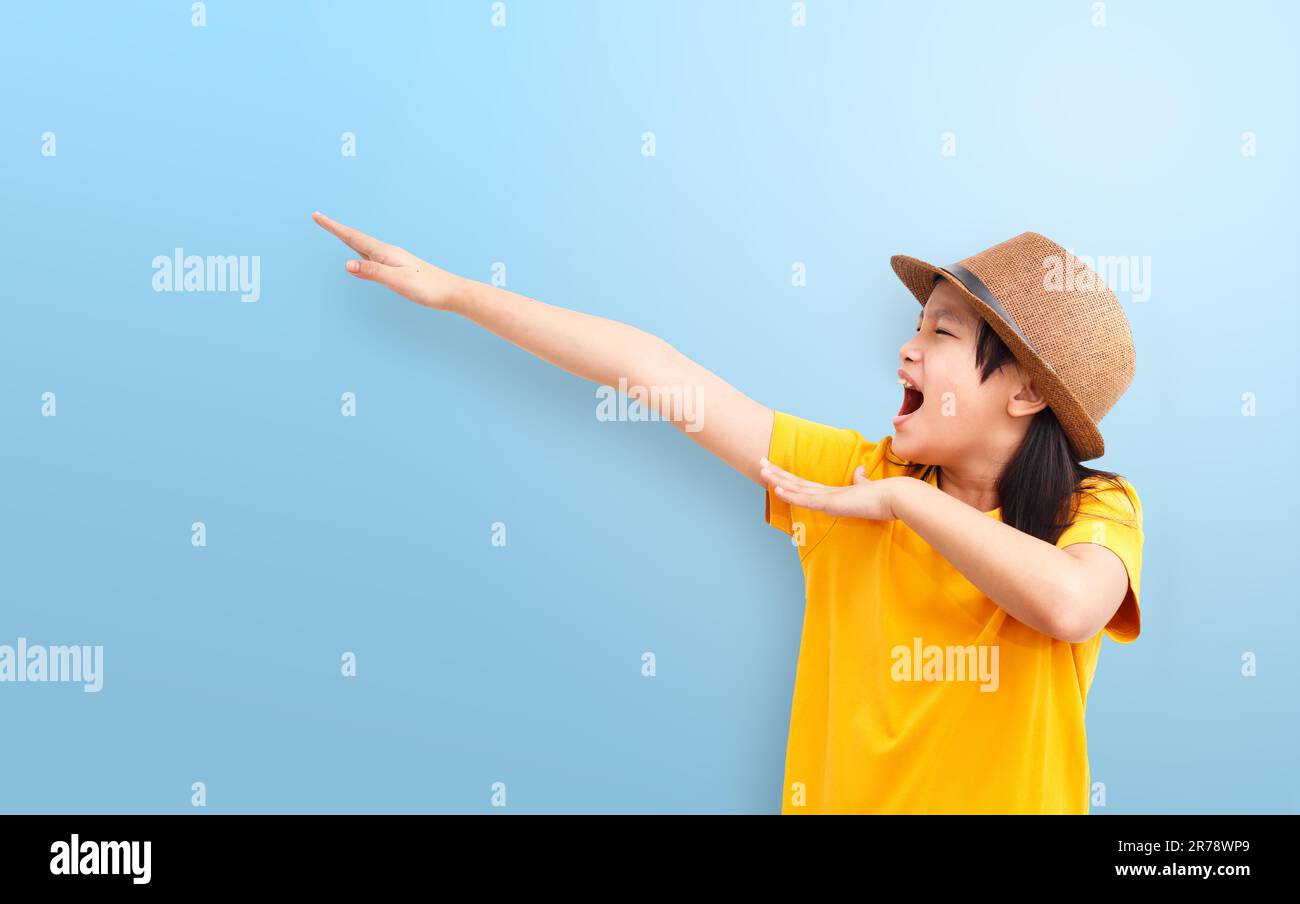 Asian girl makes a dab movement and open her mouth for shouting on a ...