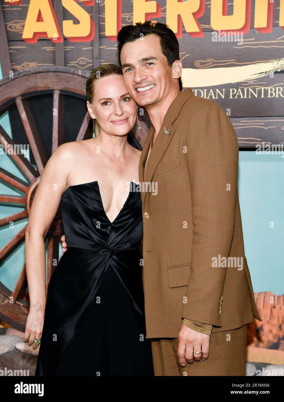 Aimee Mullins, left, and Rupert Friend attend the premiere of "Asteroid ...