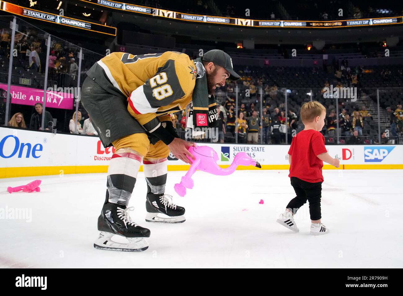 Vegas Golden Knights left wing William Carrier skates behind a child ...