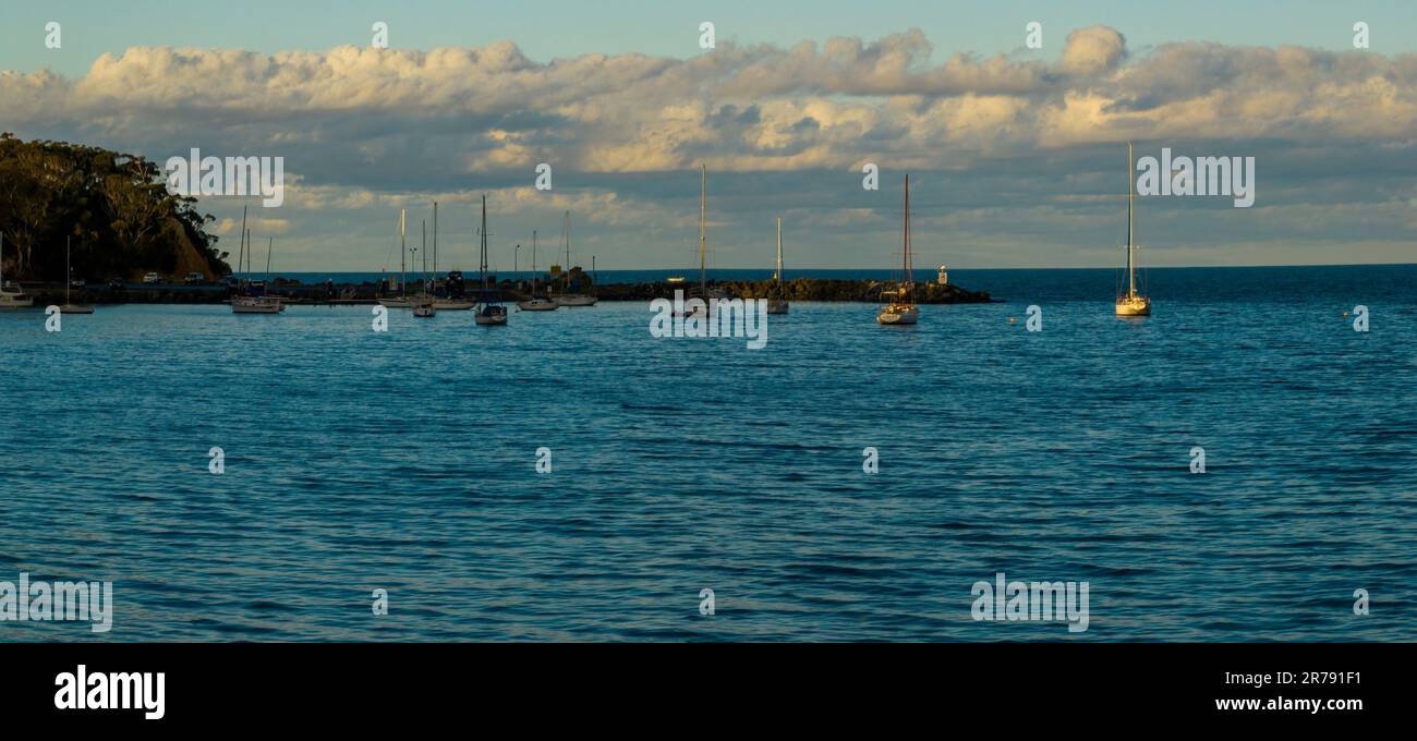 White clouds in a blue sky over the ocean at Nullica Bay, Quarantine ...