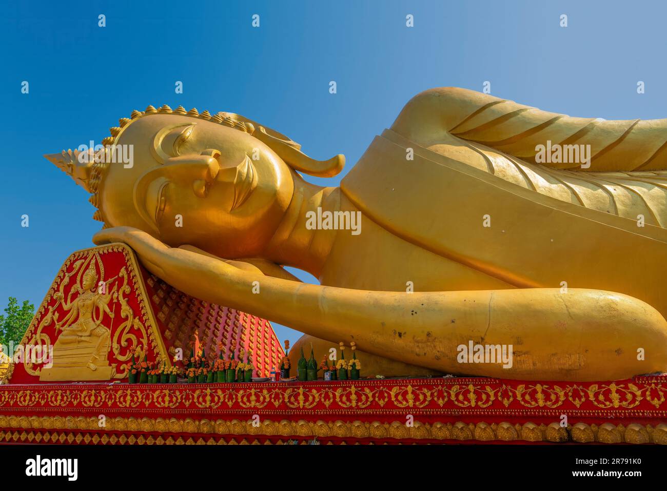 Gold Reclining Sleeping Buddha Statue at Wat That Luang Neua, one of ...
