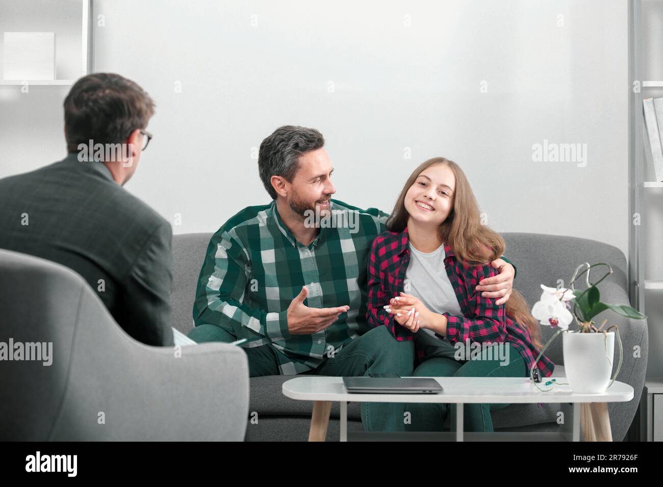 Psychologist helping father with daughter to solve child problems ...