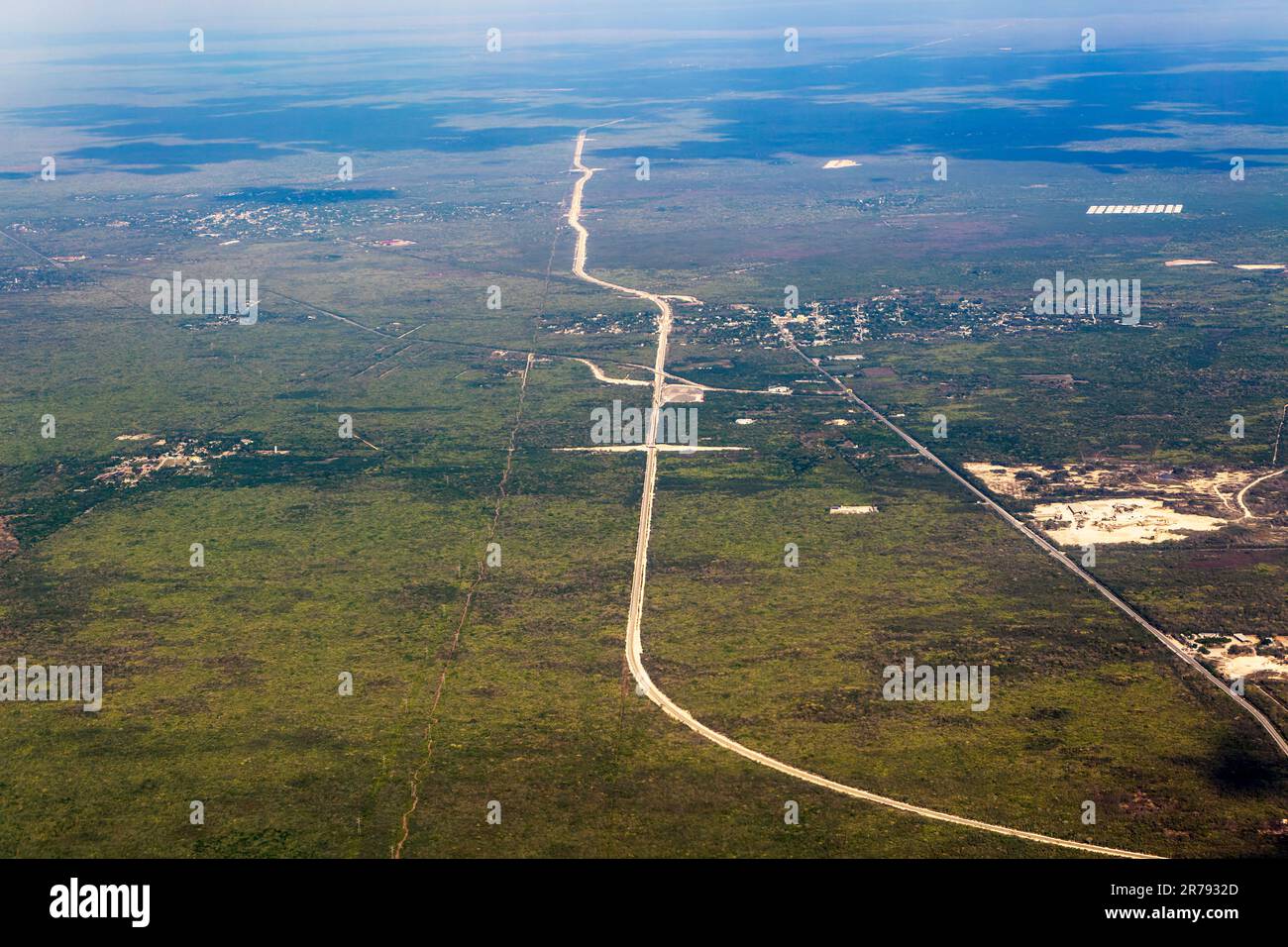 Oblique angle aerial view plane window over new railway tracks of Train ...