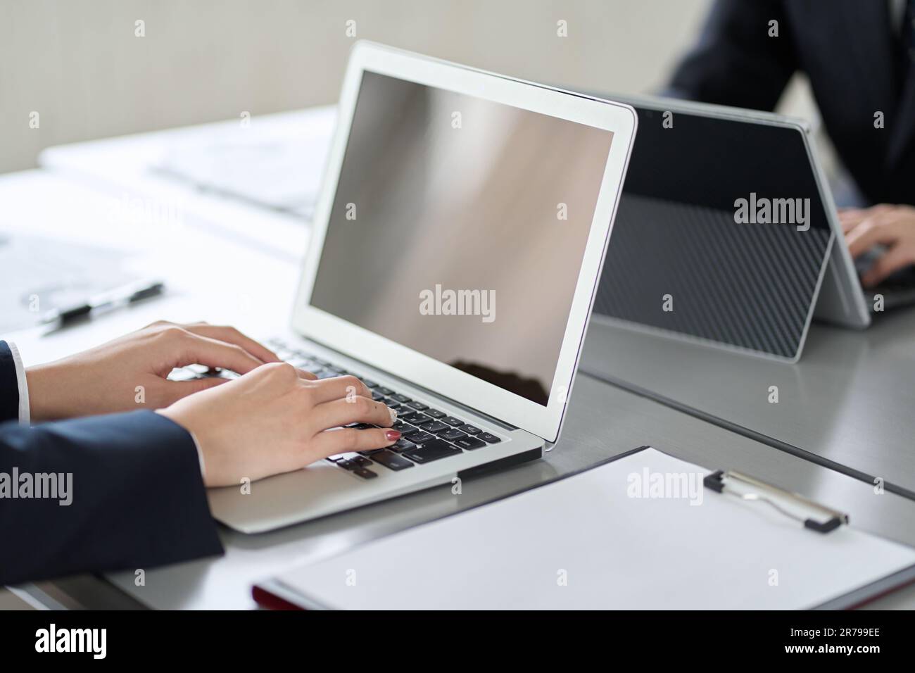A business person who operates a laptop for desk work Stock Photo - Alamy