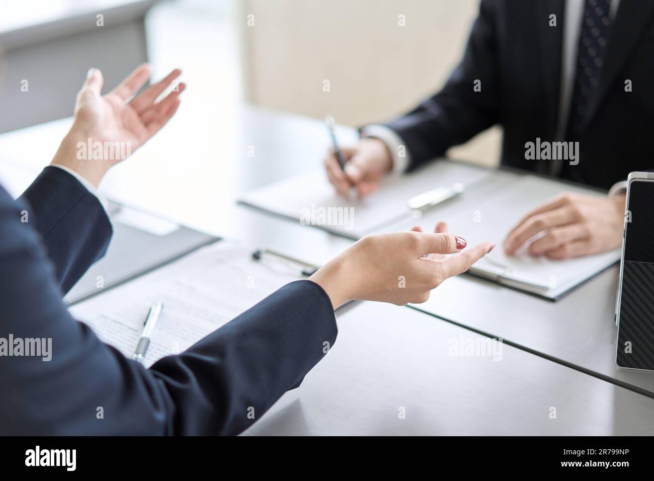 Hand of a business woman giving an explanation at a meeting Stock Photo ...