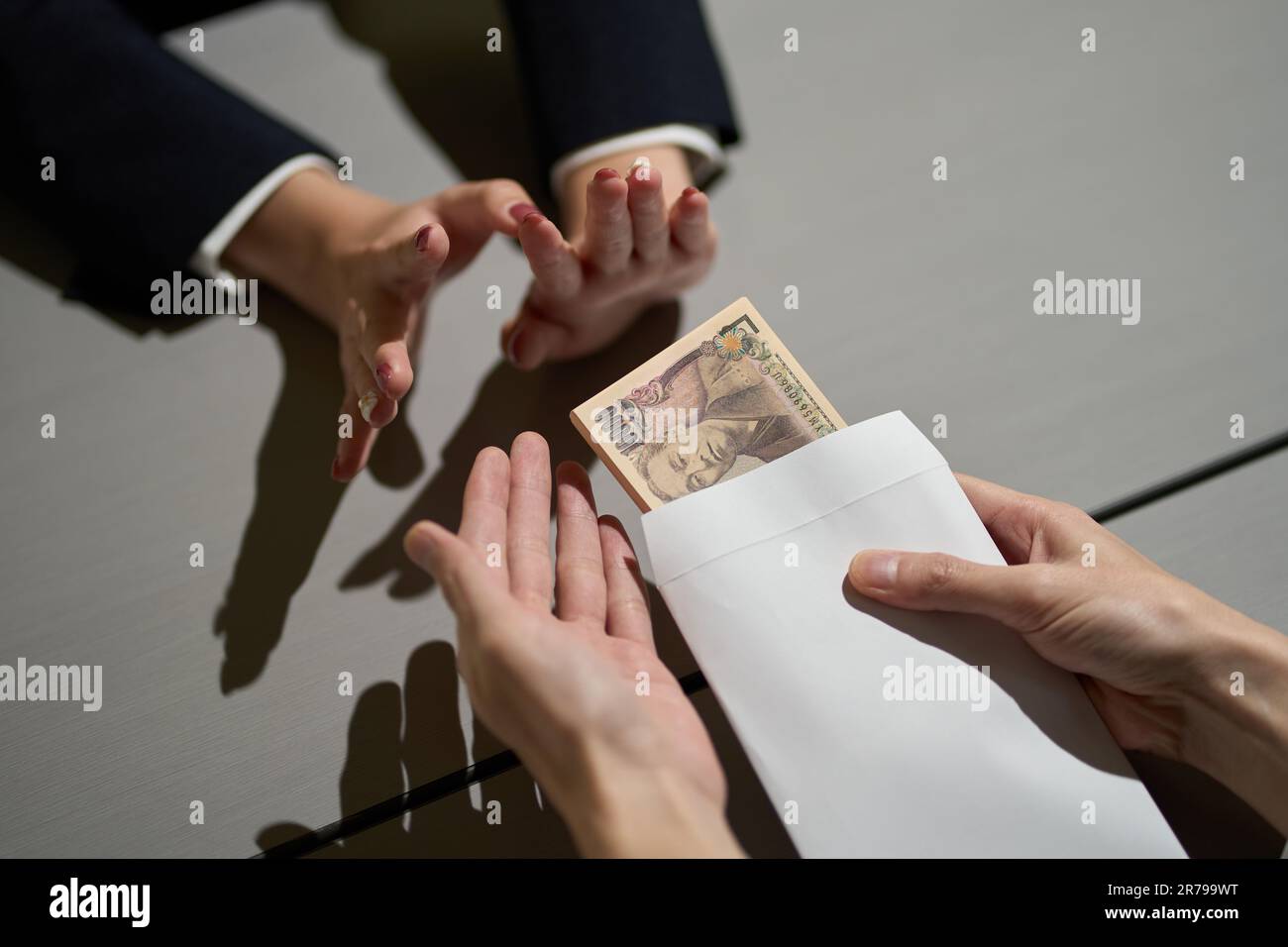Hand of a woman who refuses to receive money Stock Photo - Alamy