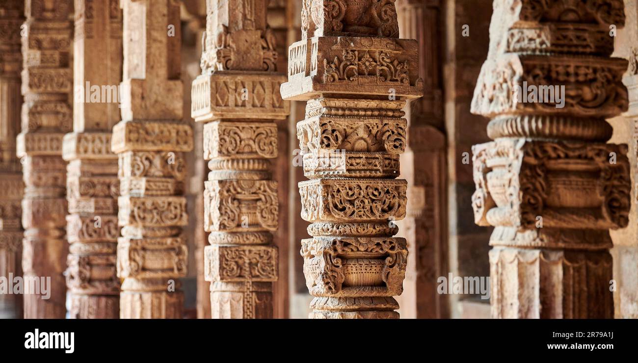 Stone columns with decorative bas relief of Qutb complex in South Delhi ...