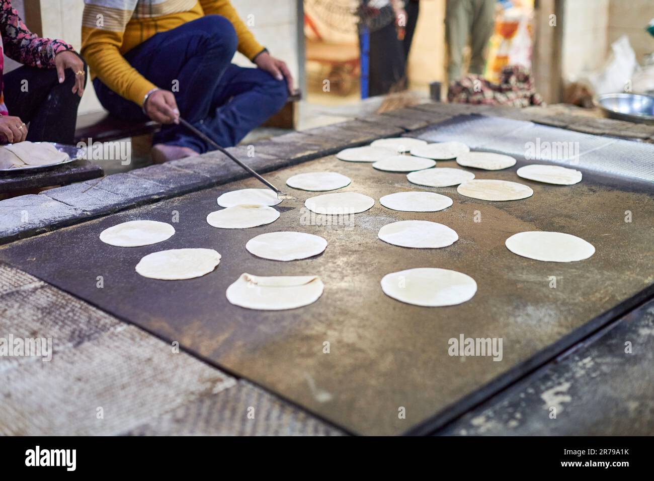 Cooking of chapati round flatbreads for langar in sikh gurudwara temple ...