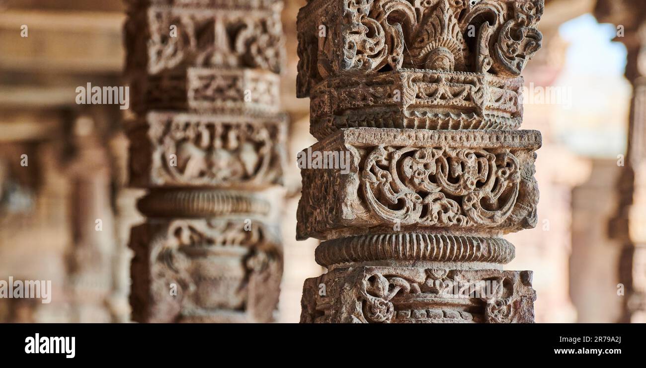 Stone columns with decorative bas relief of Qutb complex in South Delhi ...