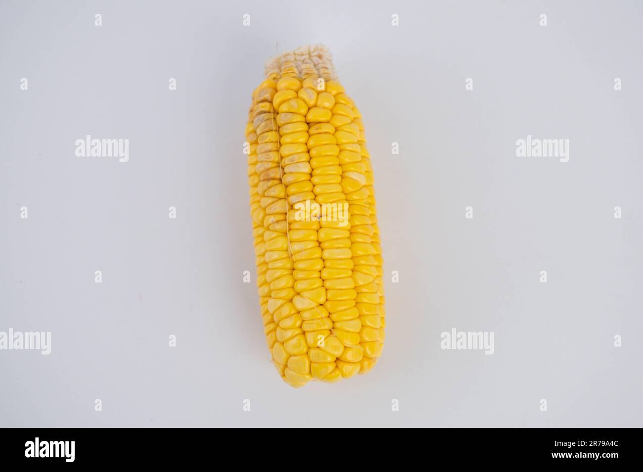 Peeled corn on a white background. Sweet corn vegetables, fresh peeled ...
