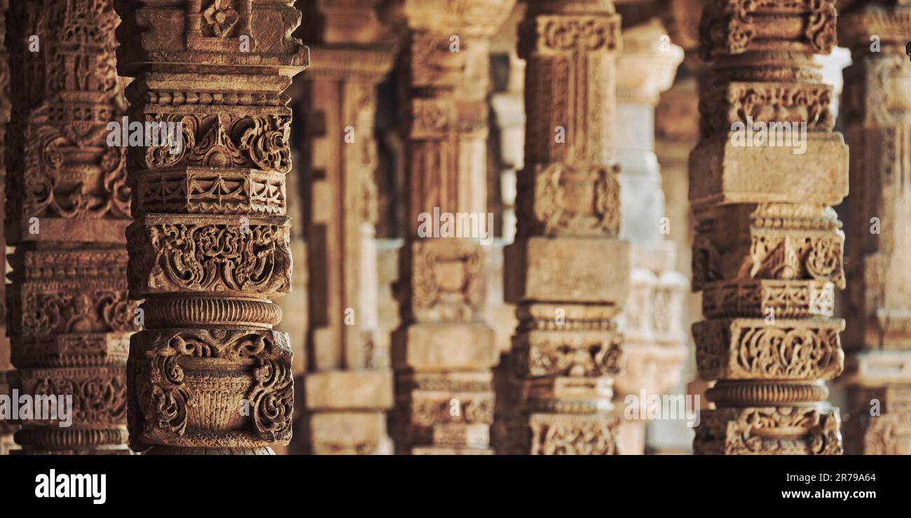 Stone columns with decorative bas relief of Qutb complex in South Delhi ...