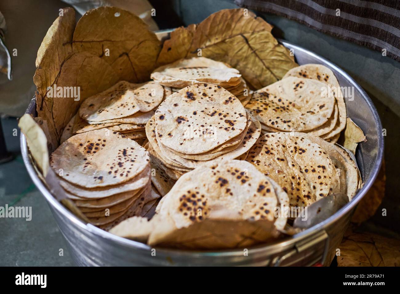 Batch of chapati round flatbreads in bucket for langar in sikh ...
