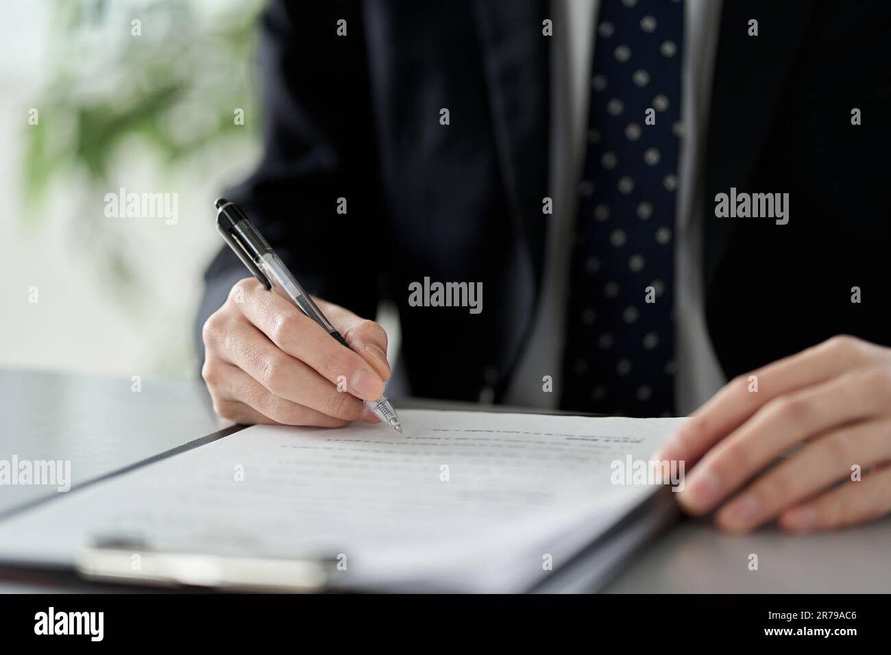 Asian businessman checking the content of documents Stock Photo - Alamy