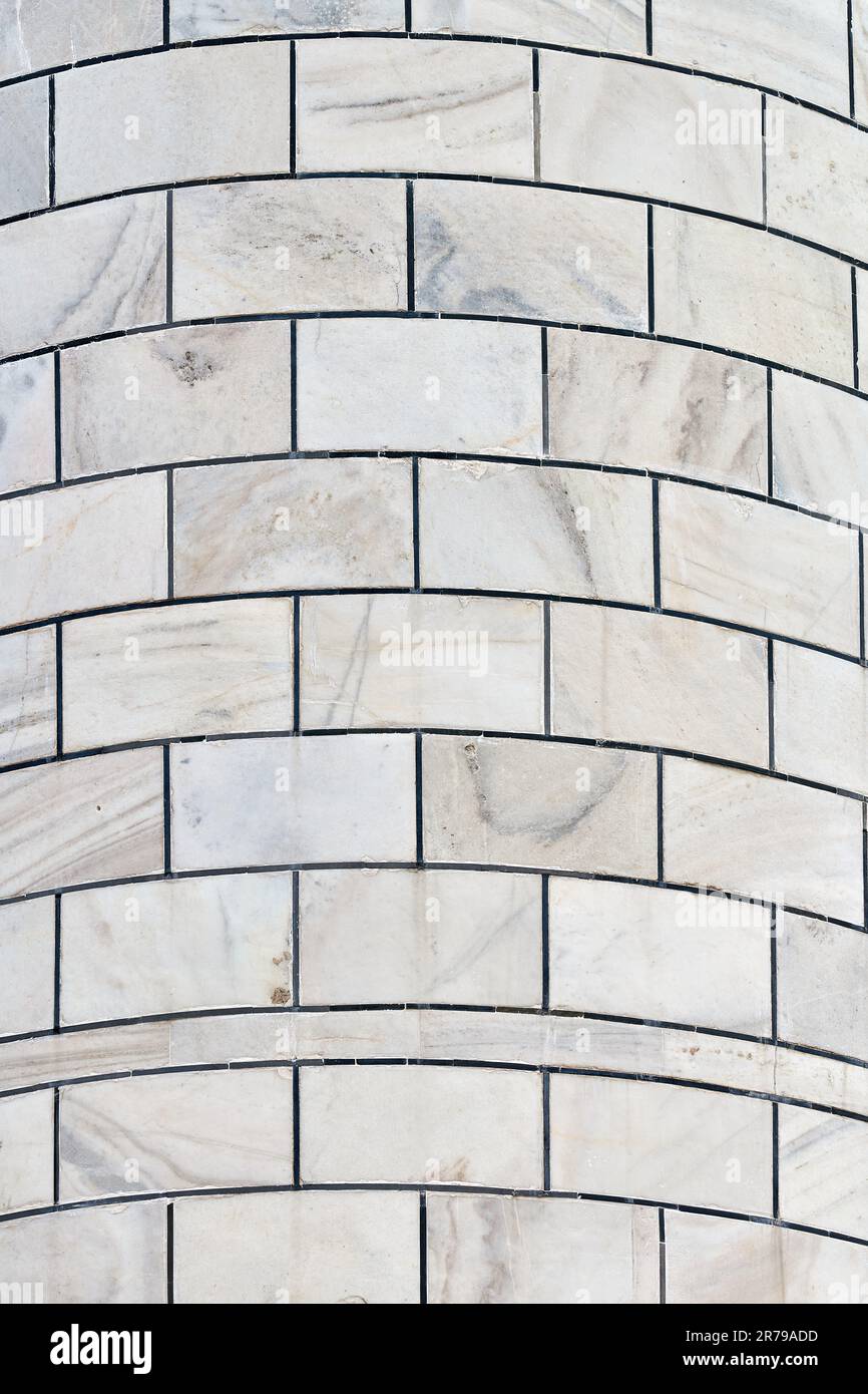 White marble bricks of Taj Mahal minaret towers, close up ivory white ...