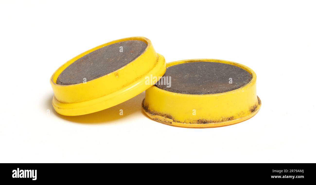 Old small magnets isolated on a white background Stock Photo - Alamy
