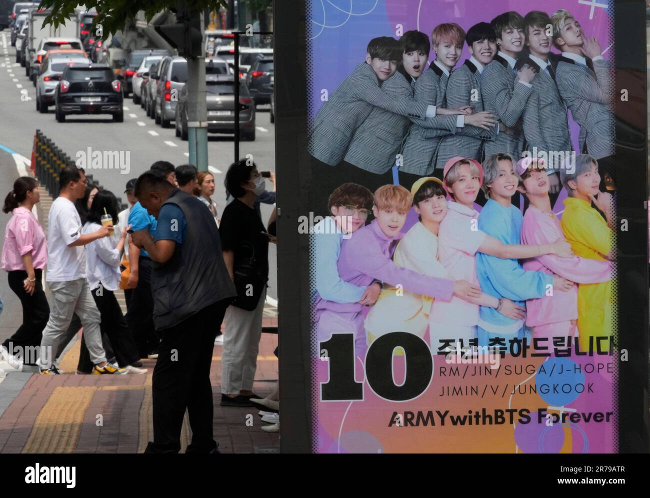 A poster showing K-pop band BTS members is displayed to celebrate its ...