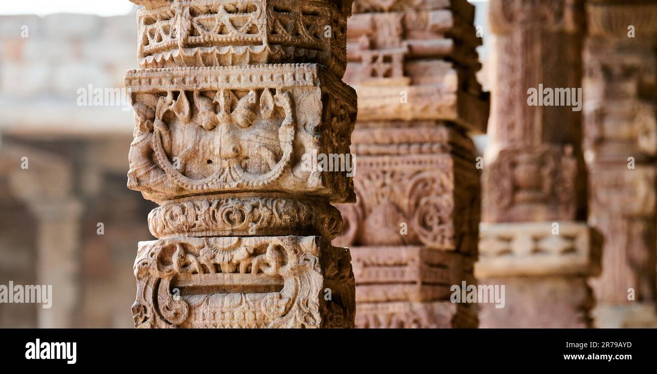Stone columns with decorative bas relief of Qutb complex in South Delhi ...