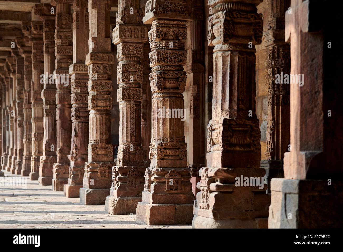 Stone columns with decorative bas relief of Qutb complex in South Delhi ...