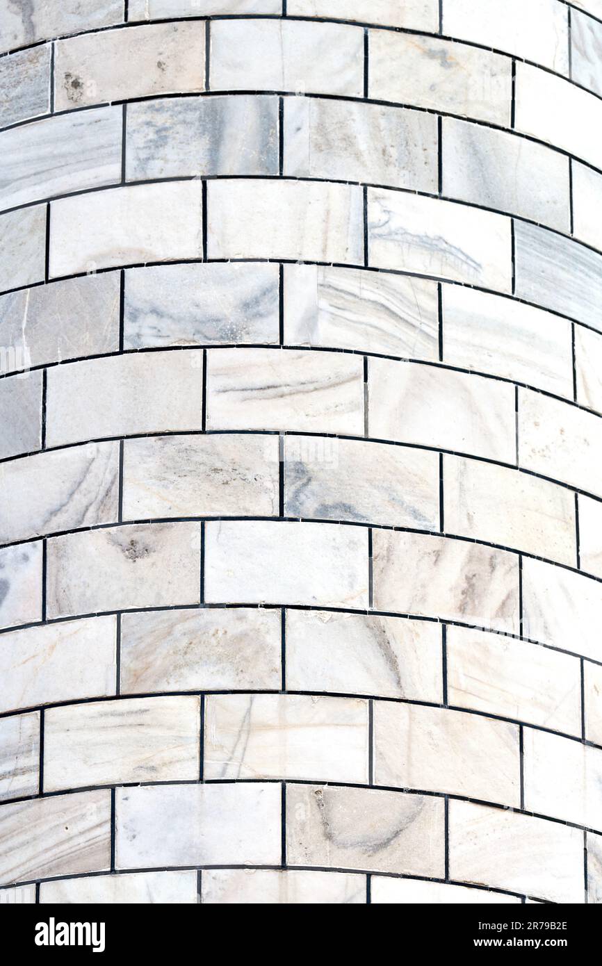 White marble bricks of Taj Mahal minaret towers, close up ivory white ...