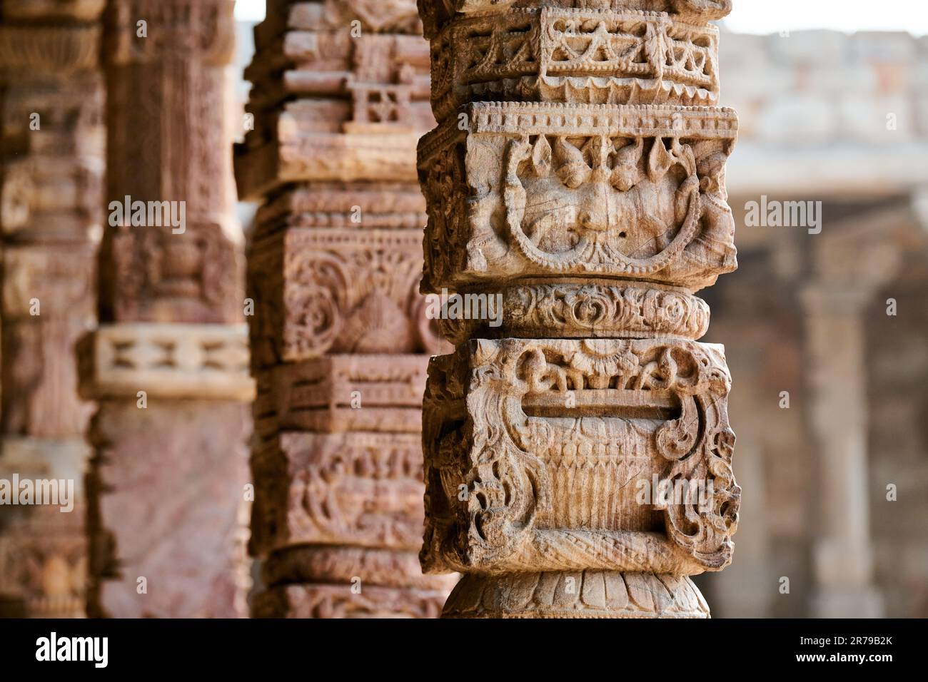 Stone columns with decorative bas relief of Qutb complex in South Delhi ...
