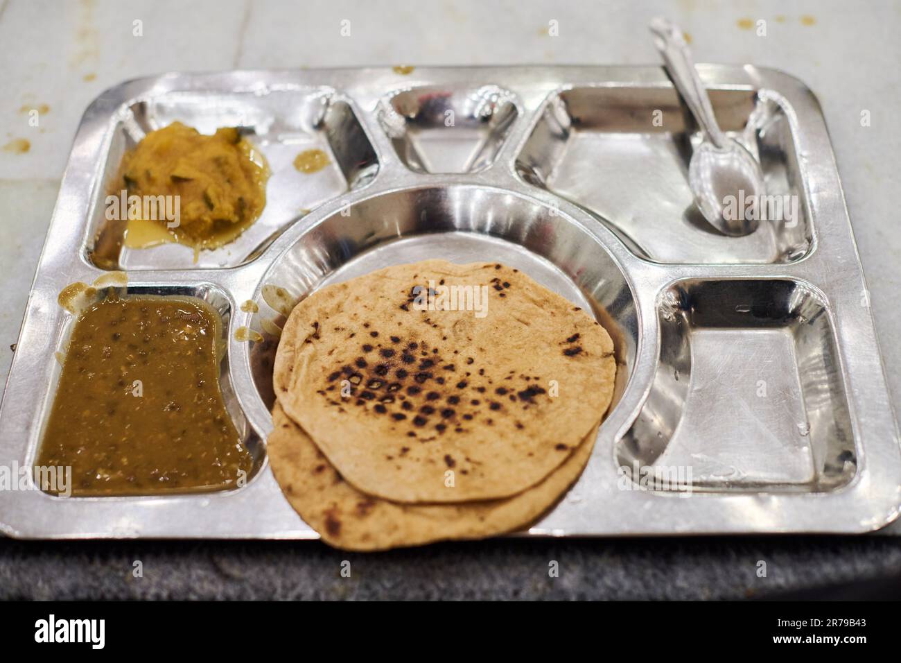 Silver tray with chapati, dal and sabji vegetable puree free food for ...