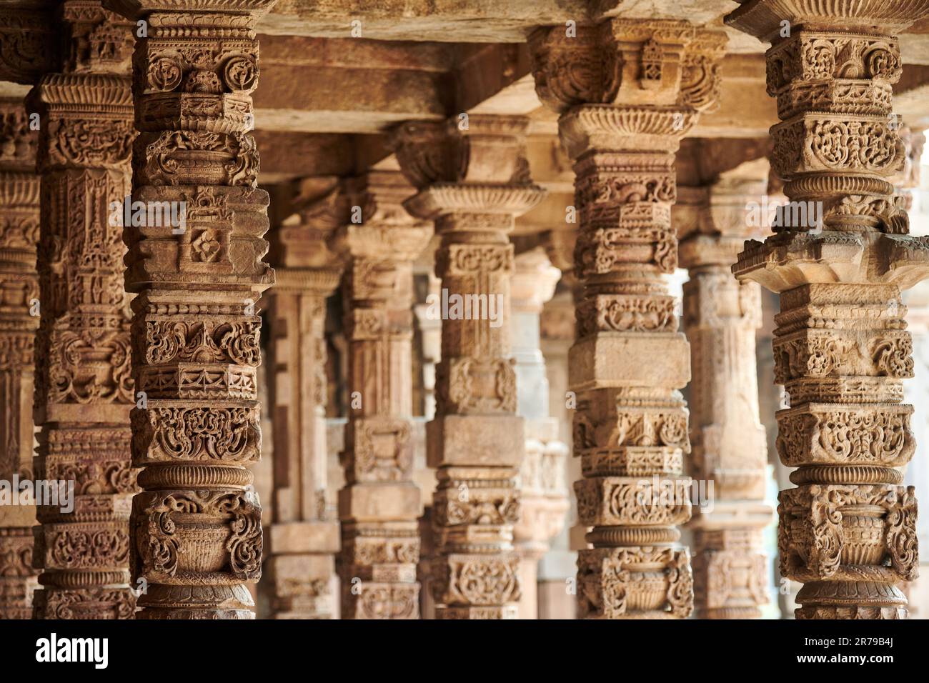 Stone columns with decorative bas relief of Qutb complex in South Delhi ...