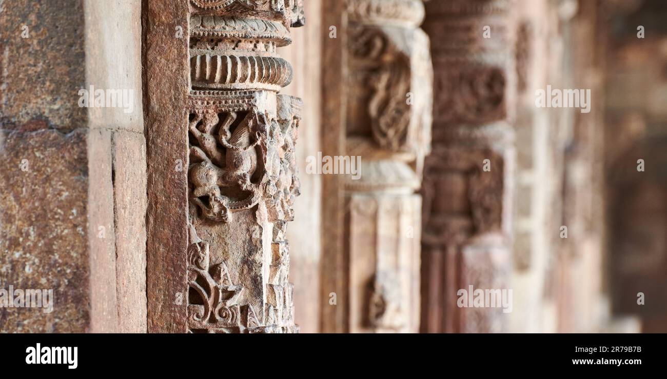Stone columns with decorative bas relief of Qutb complex in South Delhi ...