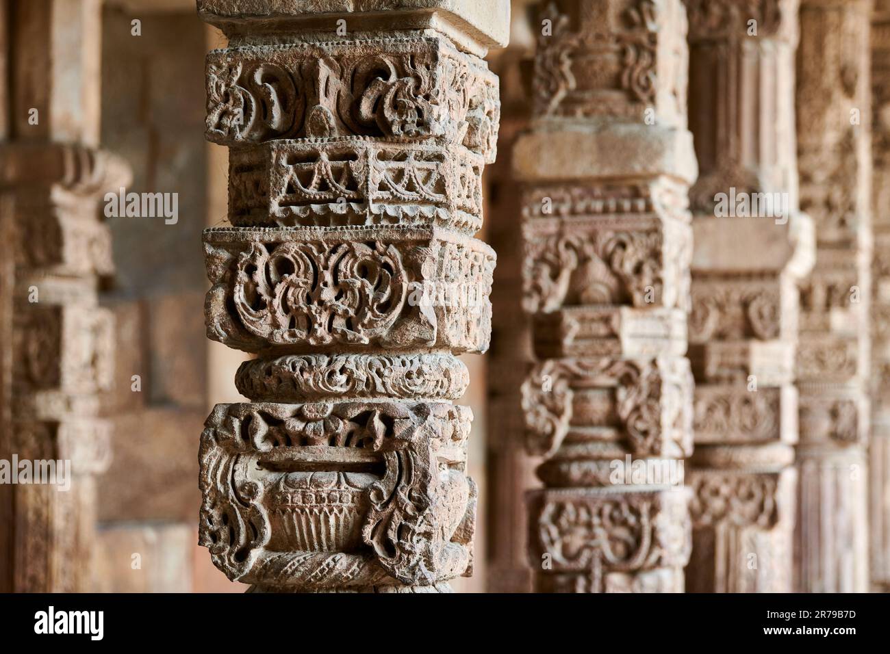 Stone columns with decorative bas relief of Qutb complex in South Delhi ...