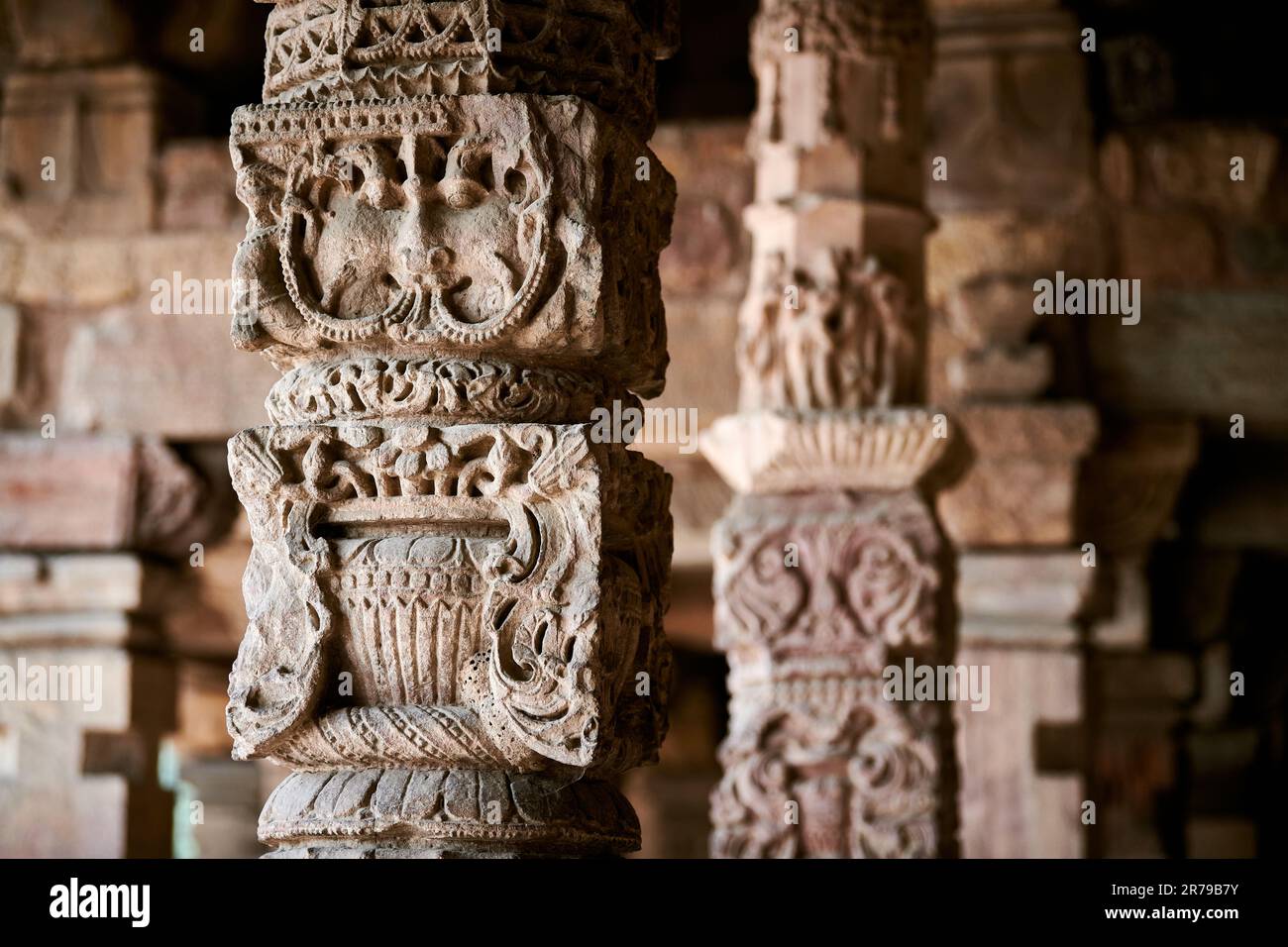 Stone columns with decorative bas relief of Qutb complex in South Delhi ...