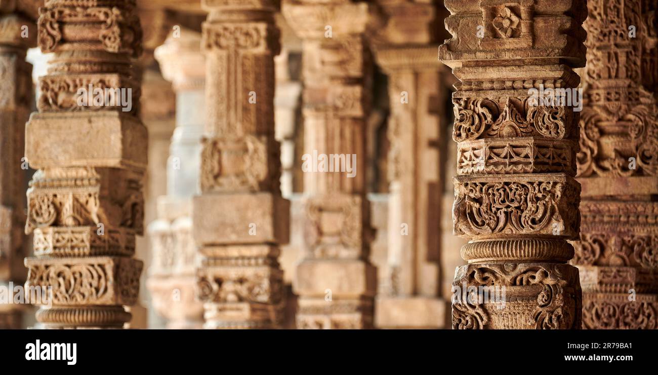 Stone columns with decorative bas relief of Qutb complex in South Delhi ...