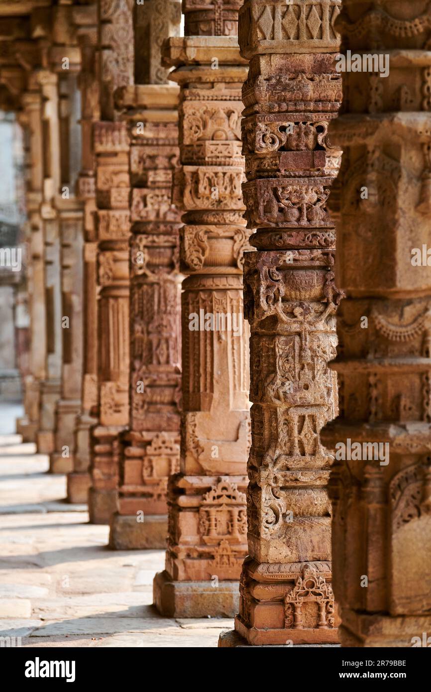 Stone columns with decorative bas relief of Qutb complex in South Delhi ...