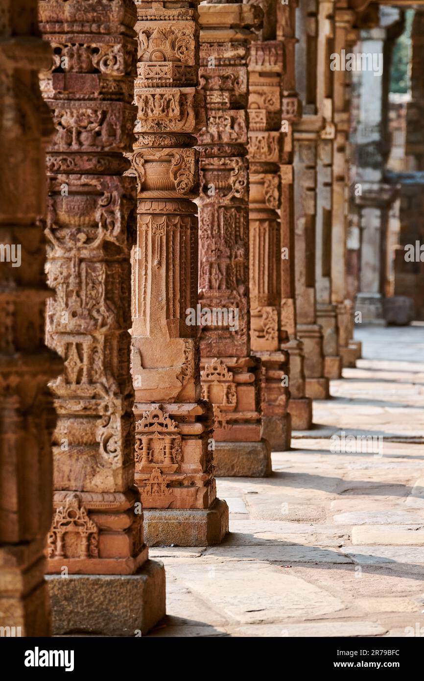 Stone columns with decorative bas relief of Qutb complex in South Delhi ...